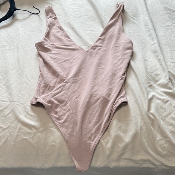 Aritzia | Tops | Aritzia Pink Bodysuit | Poshmark